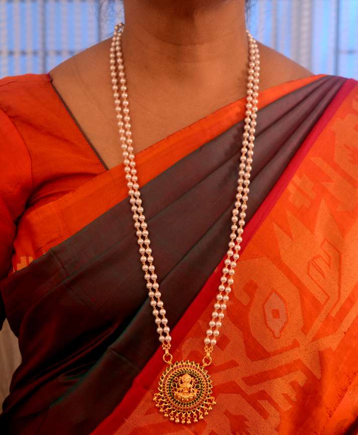 Radha s Creations Pearl two layer necklace with Laxmi pendant one gram gold Gold plated Plated Brass Layered Price in India Buy Radha s Creations Pearl two layer necklace with Laxmi pendant one gram