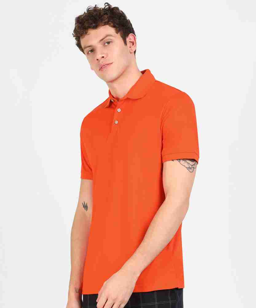 Calvin Klein Solid Men Polo Neck Orange T Shirt Buy Calvin Klein Solid Men Polo Neck Orange T Shirt Online at Best Prices in India Flipkart